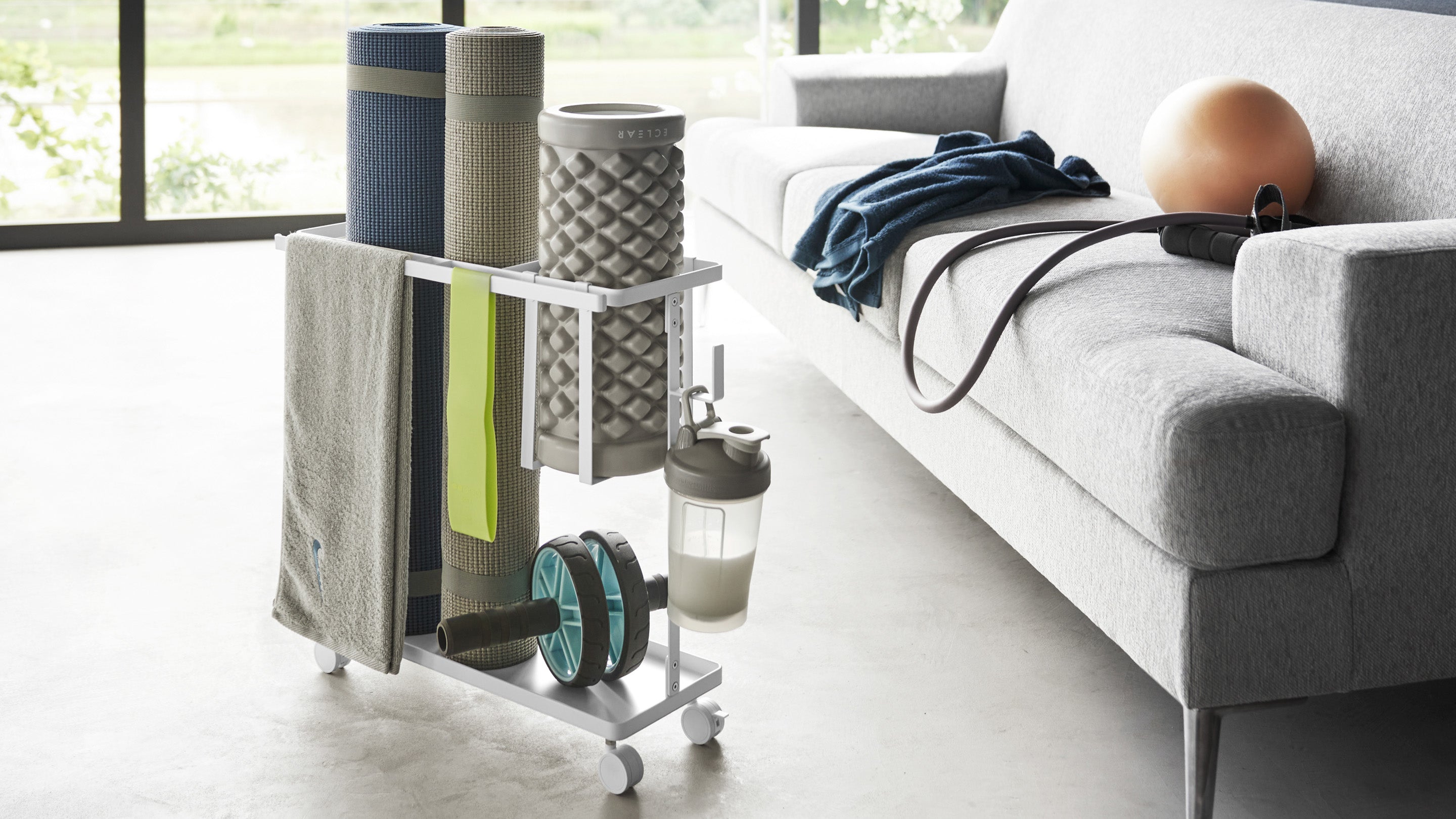 Fitness Equipment Storage Cart by Yamazaki Home in white in a living ...